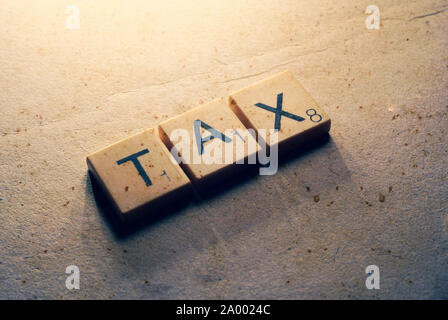 Tax label composed from scrabble letters Stock Photo - Alamy