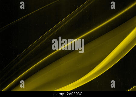 A real wisp of yellow smoke on an orange background with grain, dust ...