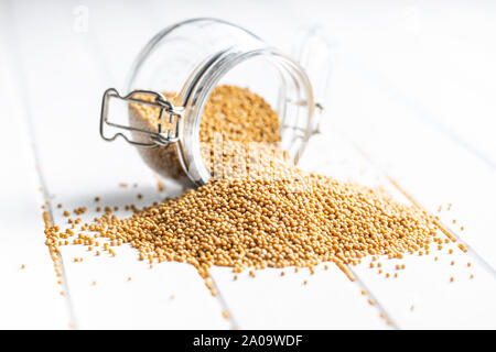 yellow mustard seeds in glass bowl isolated on white background Stock ...