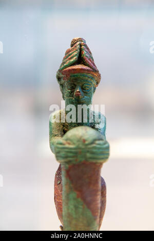Kneeling god placing a nail in the ground and tablet commemorating the ...