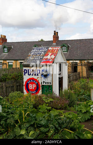 Old advertising signs put to good use Stock Photo - Alamy