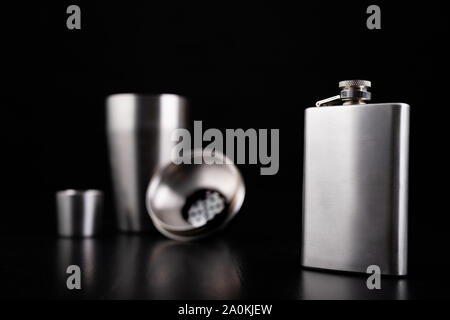 Hip flask and stainless steel shaker. Bartender accessories on the ...