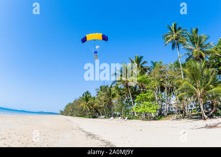 Skydiving skydiver and passenger tandem parachute approach on the ...
