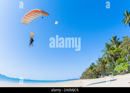 Skydiving skydiver and passenger tandem parachute approach on the ...