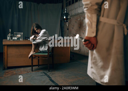 Male psychiatrist and crazy female patient in a fit of rage, mental ...