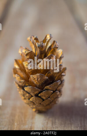 Beautiful golden decorative christmas tree and gifts on golden glitter ...