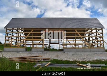 Barn under construction framed and partially complete on a farm in a ...