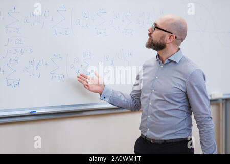 Multinational group of cheerful students taking an active part in a ...