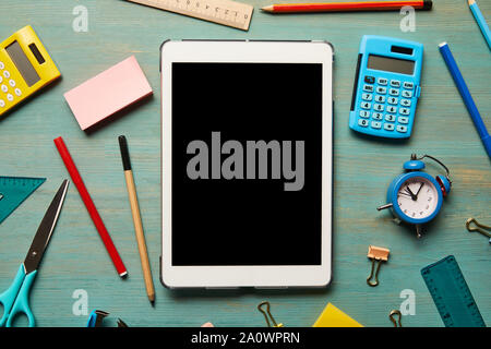 Pink table with digital tablet, stationery and copy space, clipping ...