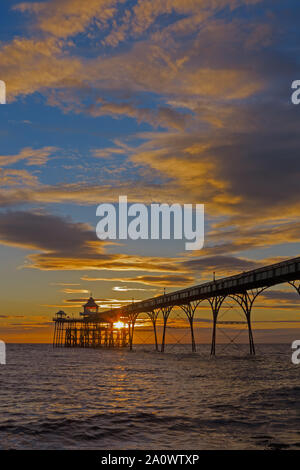 The setting sun lighting up the cloud cover Stock Photo - Alamy
