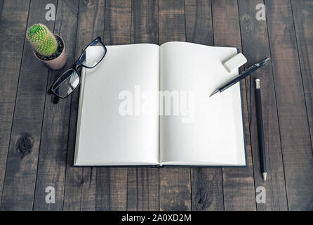 White blank pages sketchbook with pencil on wood table. Close-up view ...