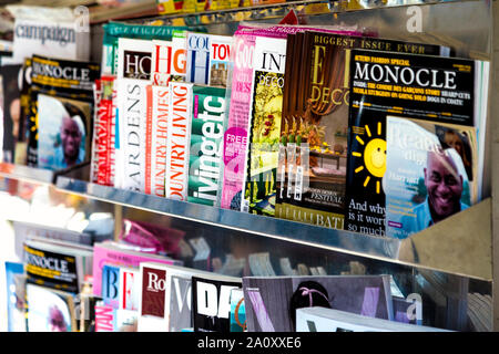 Magazines on rack of newsagent, London England UK Stock Photo - Alamy