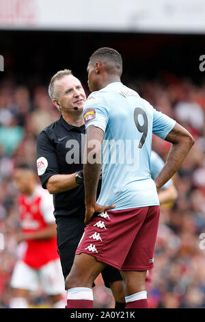 Match referee Jonathan Moss talks to Wolverhampton Wanderers' Danny ...