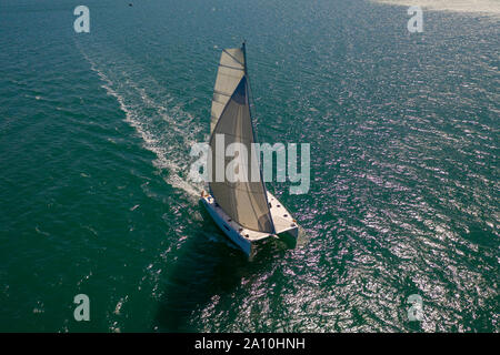 Cruising Catamaran sailing yacht under sail, shot from the air Stock ...