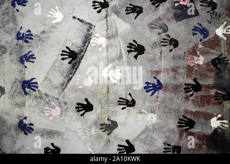 Footprints hand painted on wall, human symbol, peace Stock Photo - Alamy
