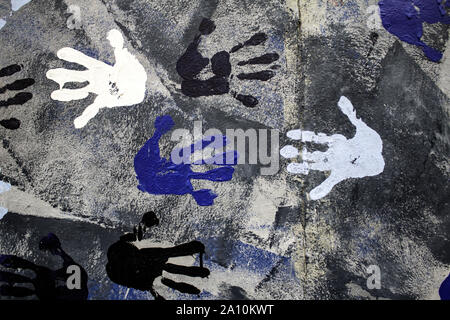 Footprints hand painted on wall, human symbol, peace Stock Photo - Alamy