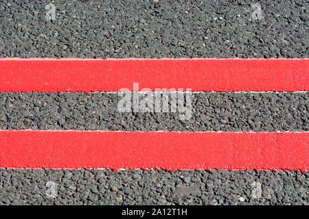 Double red lines on a no stopping route in London, UK Stock Photo - Alamy