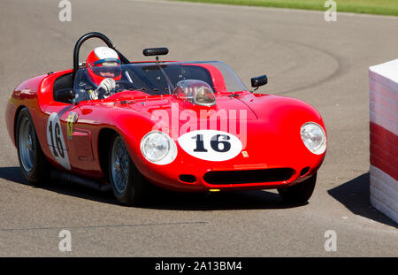 A 1960, Ferrari 246S Dino, driven by Bobby Verdon-Roe, leaving the pits ...