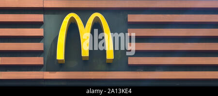 McDonald's logo sign and I'm Lovin' It slogan unusual view as seen ...