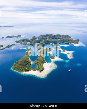 Aerial view of scattered islands on the Indian Ocean at Maldives ...