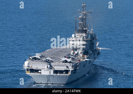 An aerial stern view of the aircraft carrier USS KITTY HAWK (CV 63 ...