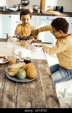 Two boys fighting on black background. Children's bullying Stock Photo ...