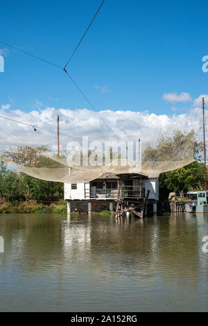 Fishing houses in dock and fishnet. Empty fishnets Stock Photo - Alamy