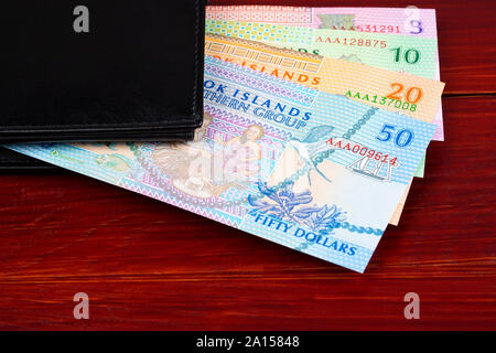 Money from Cook Islands in the black wallet Stock Photo - Alamy