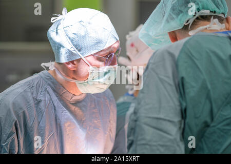 Surgeon during surgery Stock Photo - Alamy