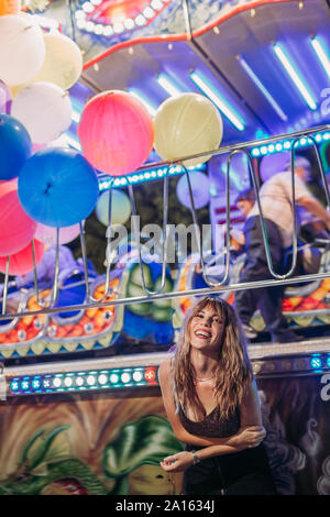 Happy woman on a funfair Stock Photo - Alamy