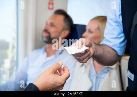 Conductor checking the tickets in a train, India Stock Photo - Alamy