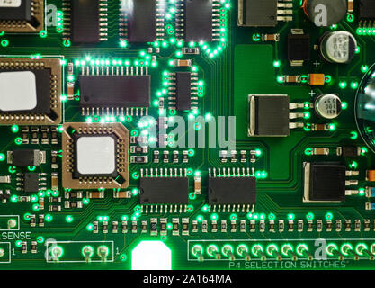 Circuit board with components in green tones. Abstract high tech ...
