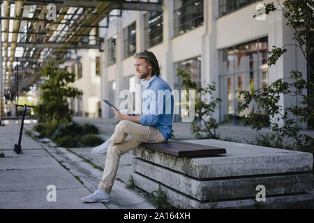 Smiling young man freelancer using laptop studying online working from ...