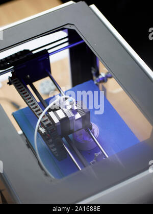 Close up of a modern 3D printer. Head of 3d printer in action. Close Up ...
