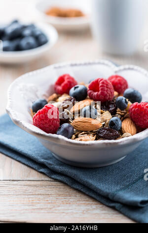 Rustic muesli breakfast with forest fruits Stock Photo - Alamy