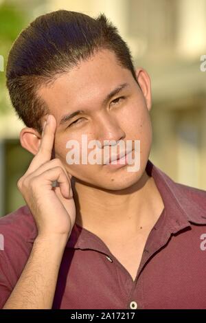 Good Looking Filipino Male Thinking Stock Photo - Alamy