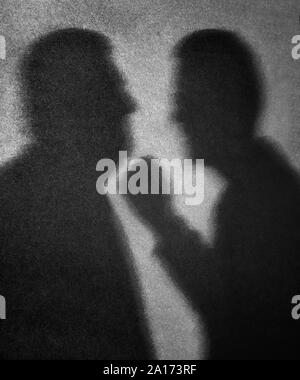 Silhouette of man boxing with shadow on the rock at sunset. Strong ...