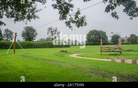 A wet children's playground in Waverton, Cheshire. The playground lies ...