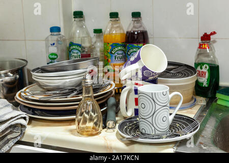 Messy Kitchen Counter With Dirty Plates, Cutlery, Glasses And Saucepans ...