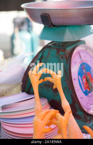 Fresh, recently deceased chicken and their upright succulent feet on ...