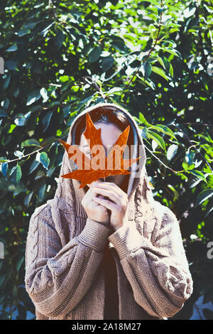 Hello november. happy young female in brown coat with autumn yellow ...