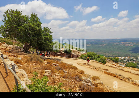 Hikers at the Keshet Cave (Arch Cave) in Adamit Park, Western Galilee ...