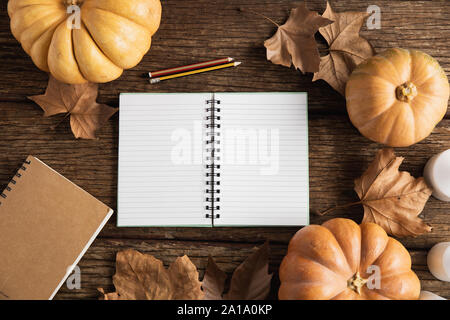 Harvest of pumpkins with fall leaves, flat lay frame, copy space on ...