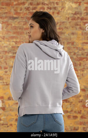 Young woman wearing casual clothes and glasses smiling friendly ...