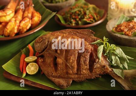 Indonesian food: Ikan goreng (fried fish) and kankung plecing (spicy ...