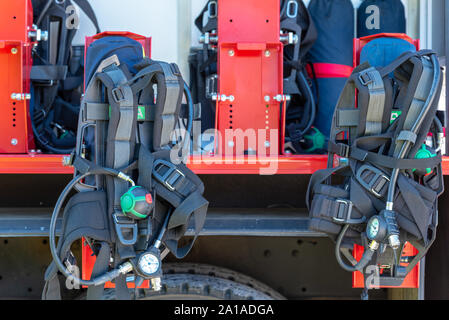 The side view of equipment inside of a fire engine. Fire truck with ...