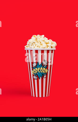 Buckets with tasty popcorn on white background Stock Photo - Alamy