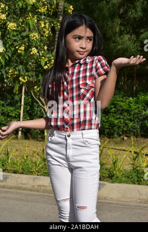 An Undecided Youthful Asian Teenager Girl Stock Photo - Alamy