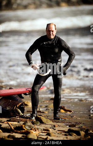 Front view of a surfboarder Stock Photo - Alamy