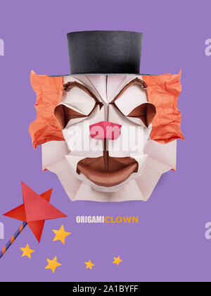Origami paper clown face isolated on violet Stock Photo - Alamy